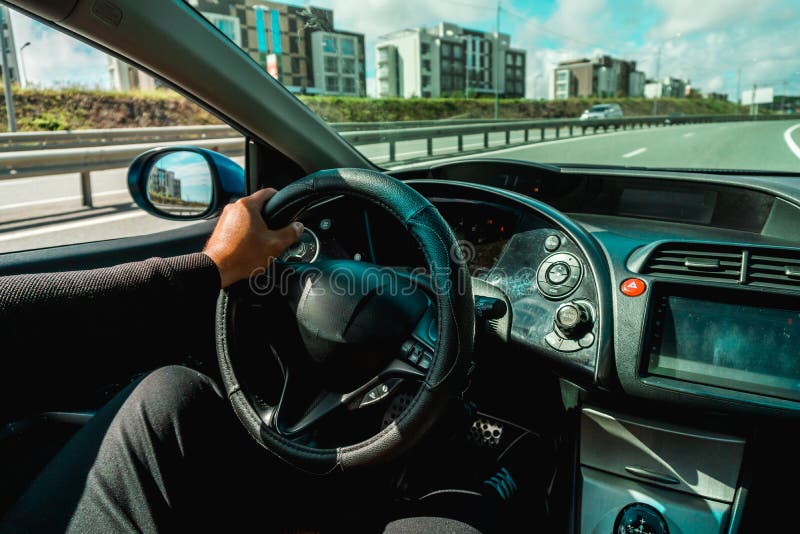 Hands of the Driver on the Steering Wheel Inside the Car Stock Image ...