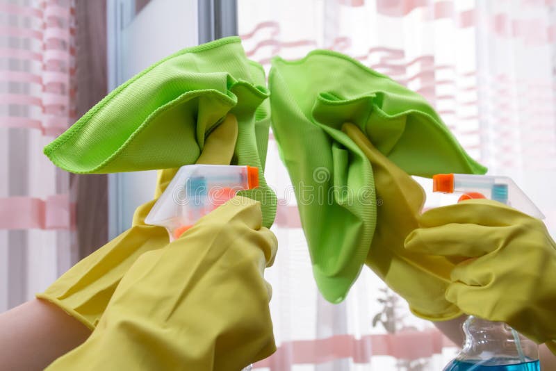 Hands with a Duster and Detergent Cleaning the Mirror Stock Image ...