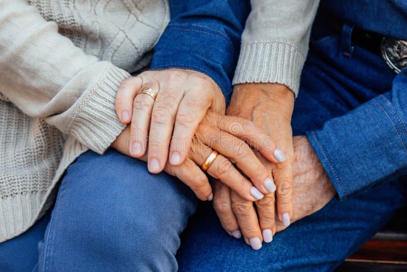 Hands of an Elderly Couple Close-up with a Wedding Ring on a Finger ...
