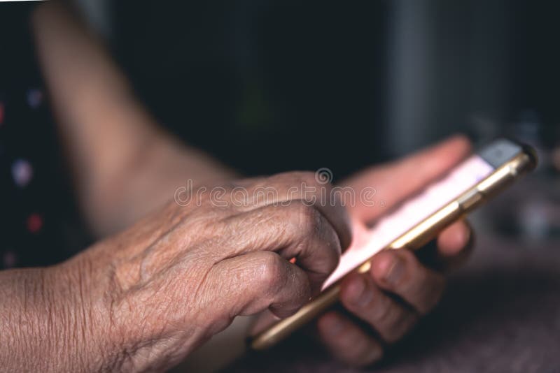 Hands of an Elderly Woman Holding a Mobile Phone. Stock Photo - Image ...