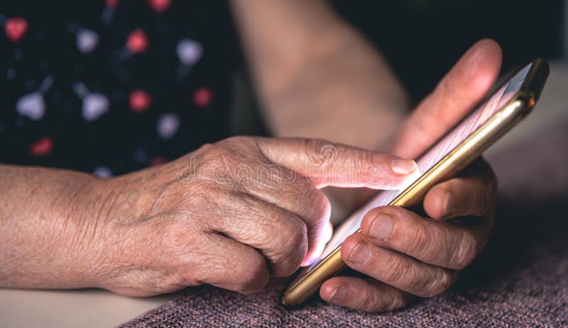 Hands of an Elderly Woman Holding a Mobile Phone. Stock Photo - Image ...