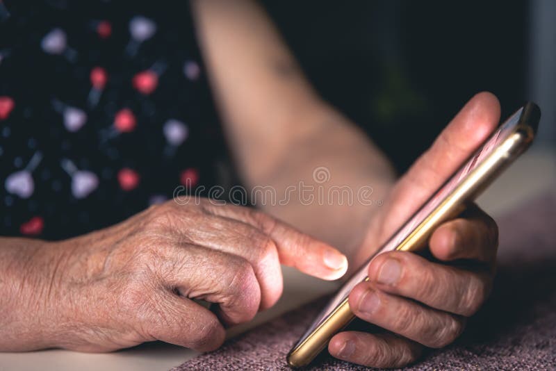 Hands of an Elderly Woman Holding a Mobile Phone. Stock Photo - Image ...