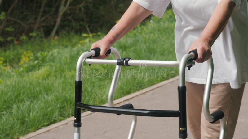 Hands of an Elderly Woman Walking with the Help of a Walker Stock Video ...