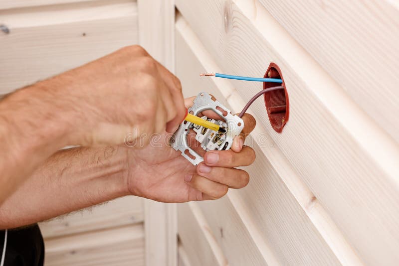 Hands of an Electrician Installing a Socket, Cutting Out a Closeup ...