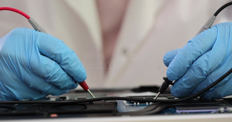 Hands of an Engineer in Gloves Using Voltmeter on Broken Computer Stock ...