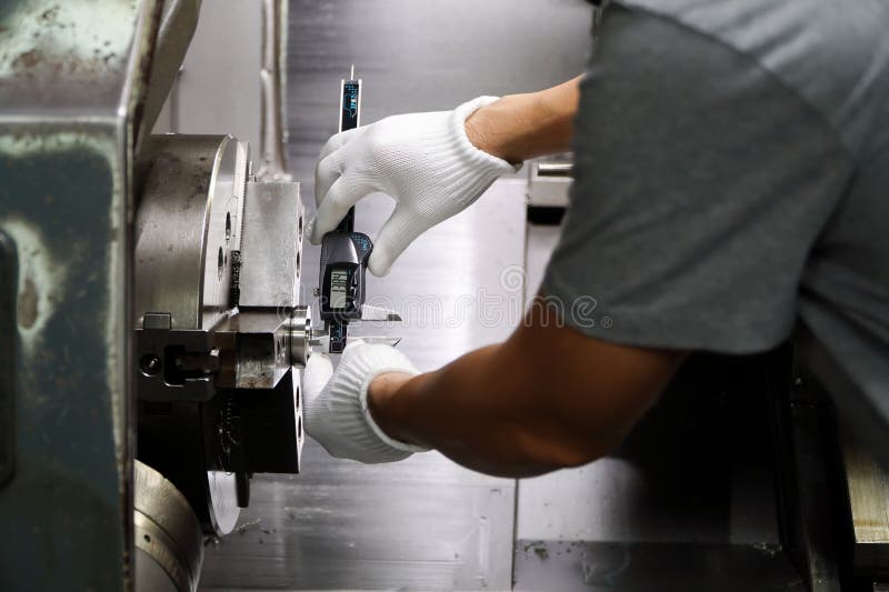 Hands of an Engineer Measures a Metal Part with a Digital Vernier ...
