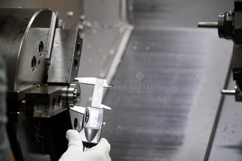 Hands of an Engineer Measures a Metal Part with a Digital Vernier ...