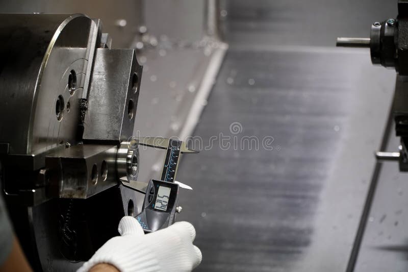 Hands of an Engineer Measures a Metal Part with a Digital Vernier ...