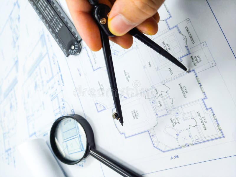 Hands of Engineer Working on Blueprint. Architecture Interior Concept ... Hands of Engineer Working on Blueprint. Architecture Interior Concept ...