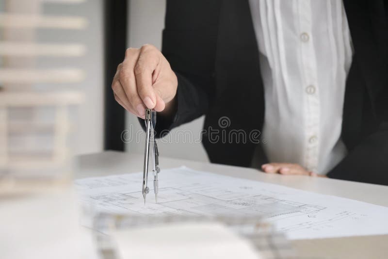 Hands of Engineer Working on Blueprint at a Workplace, Construction and ...