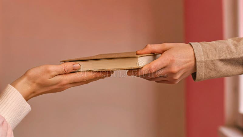 Hands Exchanging a Book in a Cozy Indoor Stock Illustration ...