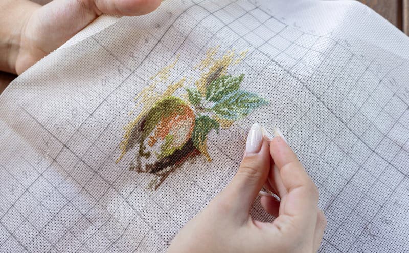 The Hands of an Experienced Craftsman Carefully Stitch the Fabric with ...