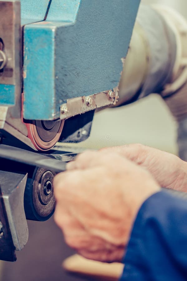 Hands of an Experienced Shoemaker Using Special Machine Tool for Making ...