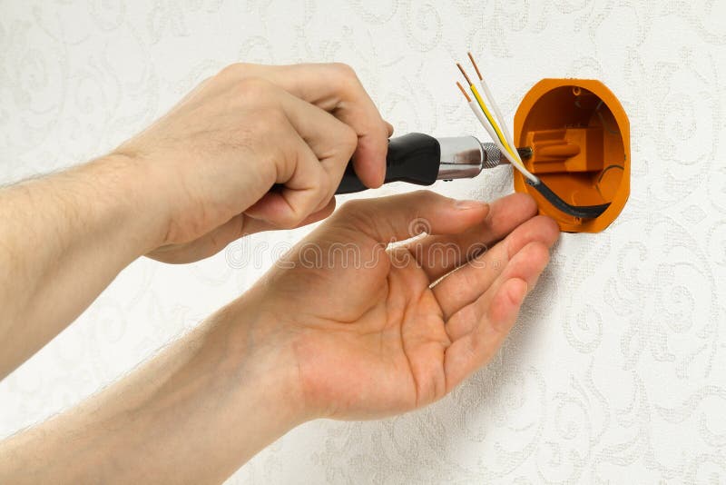 Hands Fasten Socket Box To the Wall Stock Image - Image of striping ...