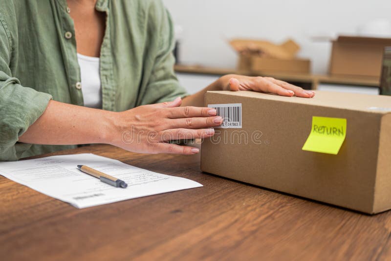 Hands of Female Consumer Stick Barcode on Cardboard Box with Yellow ...