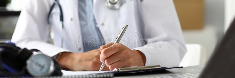 Hands of Female GP Making Notes with Silver Pen Stock Photo - Image of ...