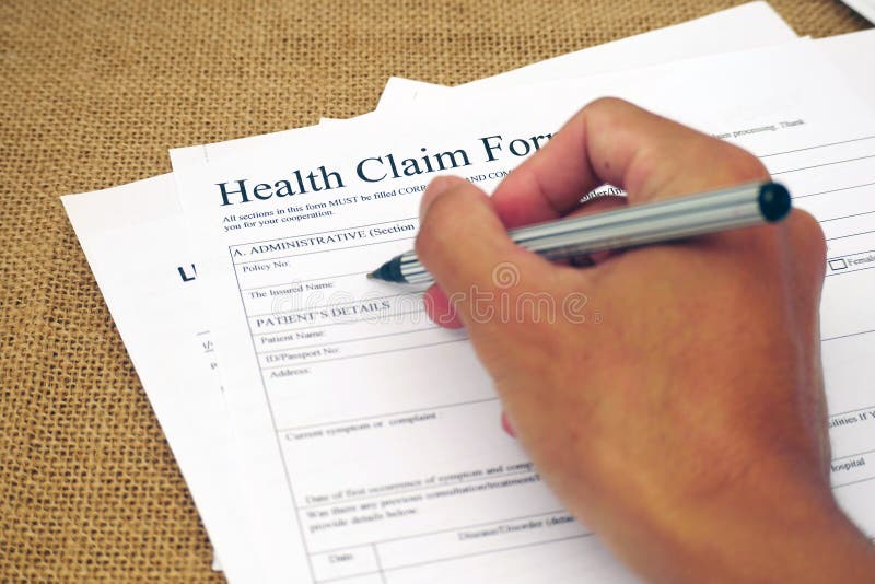 Hands Filling Out Health Claim Form. Stock Image - Image of eligibility ...