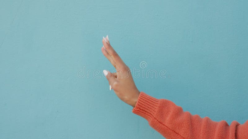 Countdown Fingers or Hand Gesture on a Mockup Blue Wall Background ...
