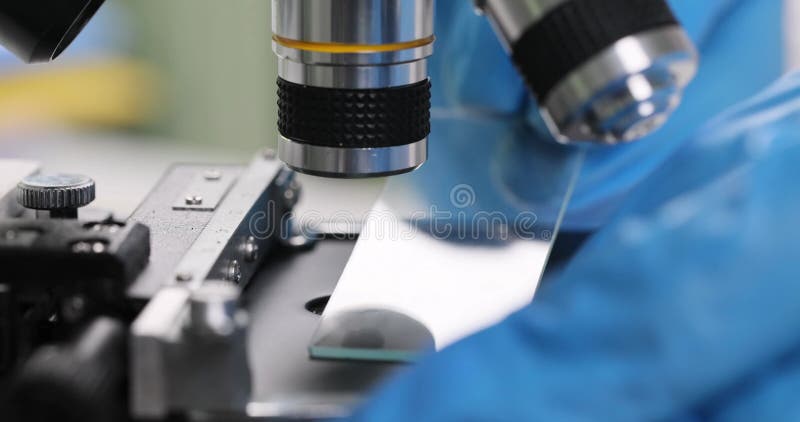 Hands Put Glass Under the Lens of a Microscope, Close-up Stock Footage ...