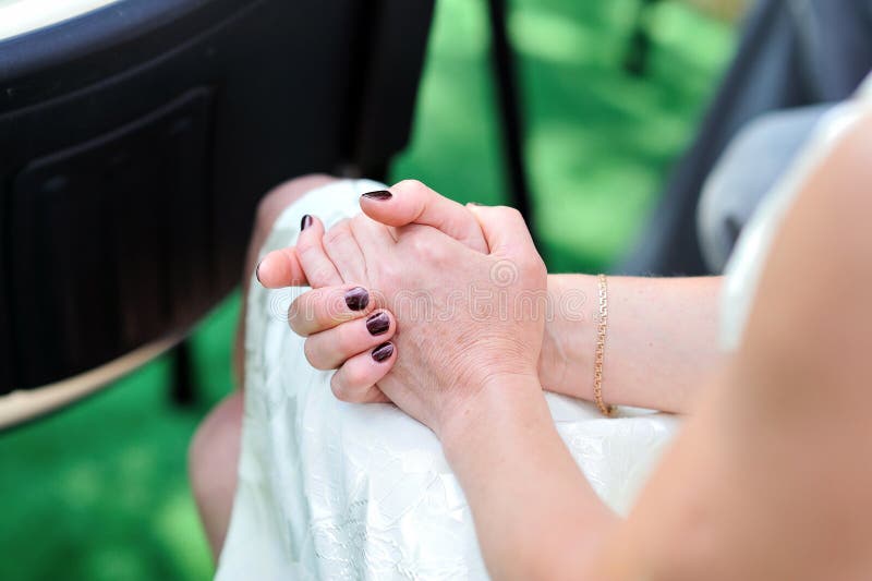Hands Folded in Her Lap with a Manicure Women Stock Photo - Image of ...