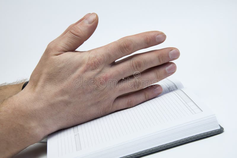 Hands Folded on an Open Notebook. on White Background Stock Image ...