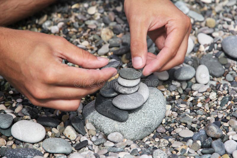 Hands folded small stones stock photo. Image of hands - 30192398