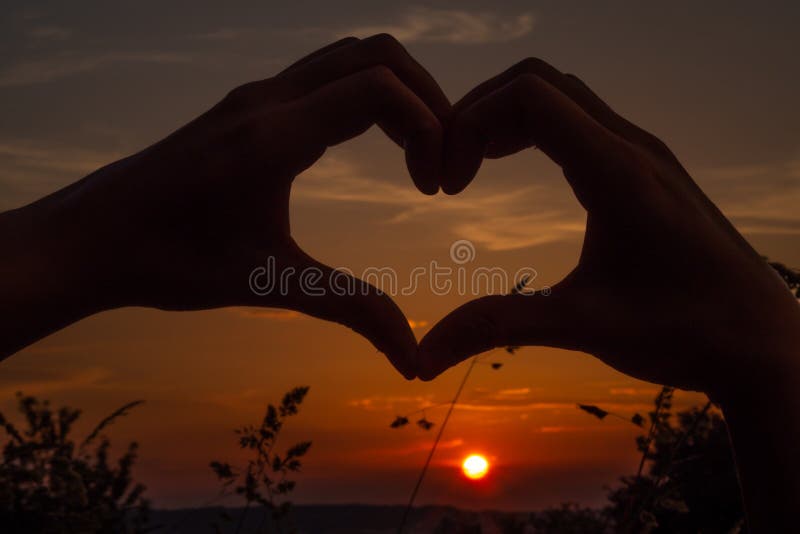 Hands Forming a Heart with a Sunset Stock Image - Image of landscape ...