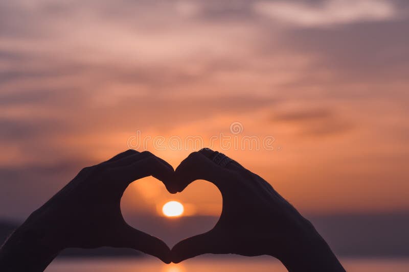 Hands Forming A Heart Shape With Sunset Stock Photo - Image of person ...