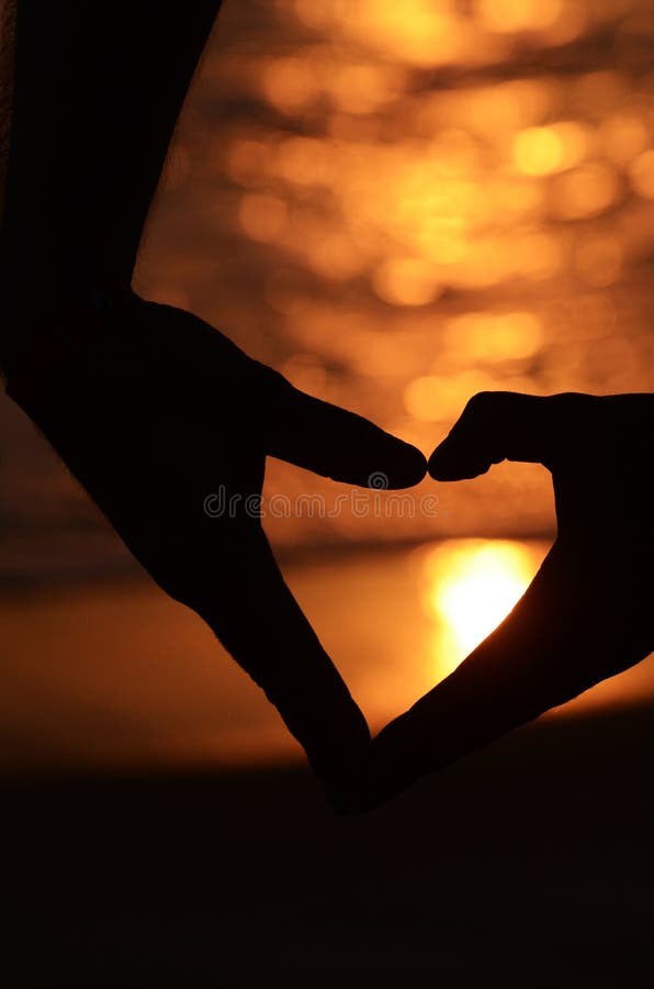 Hands Forming a Heart at the Sunset Stock Photo - Image of relationship ...