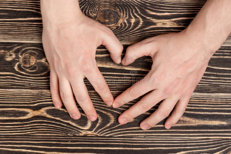 Hands Forming a Heart on Wooden Background Stock Photo - Image of love ...