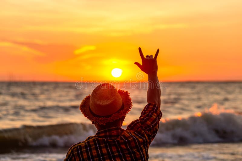 Hands Forming a Love Sign with Sunset on the Beach with Sunset Stock ...