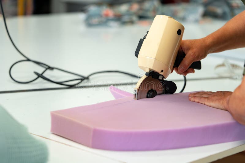 Hands of a Furniture Master Cut a Piece of Foam with Foam Cutting ...