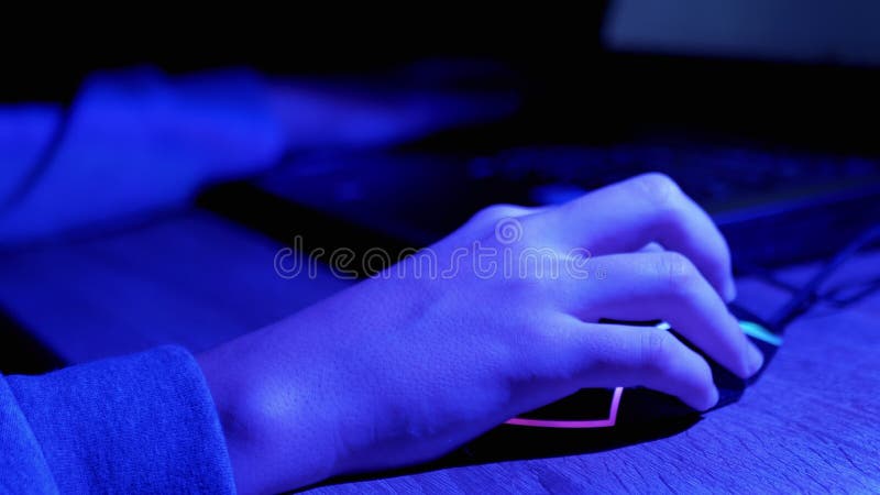 Hands of Gamer Playing Video Game at Computer in a Virtual Room at ...