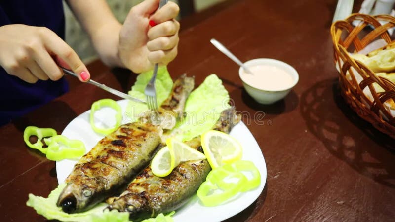 Hands of Girl Cutting Fried Fresh Fish in Cafe, Stock Footage - Video ...