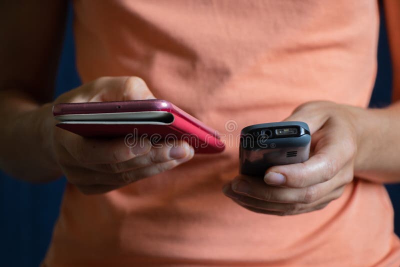 In the Hands of a Girl Push-button Old Mobile Phone and Touch New Phone ...