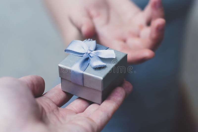 Hands Giving and Receiving a Present, Close Up. Stock Image - Image of ...