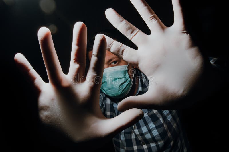 Hands in Glooves , Man with Mask in Background Stock Photo - Image of ...
