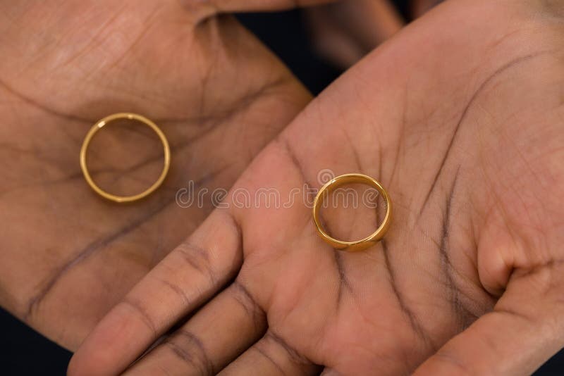 Hands with Golden Rings stock image. Image of couple - 74153679