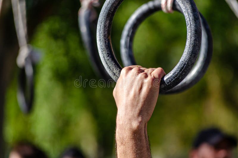 Hands Grasp a Rings at a Hanging Obstacle in an OCR Obstacle Course ...