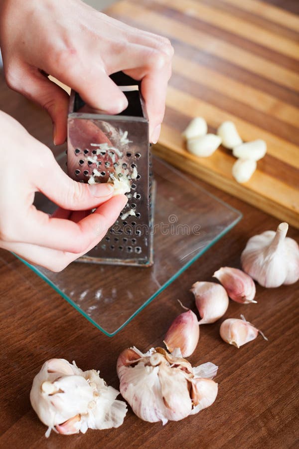 Hands grating garlic stock image. Image of girl, closeup - 38421607