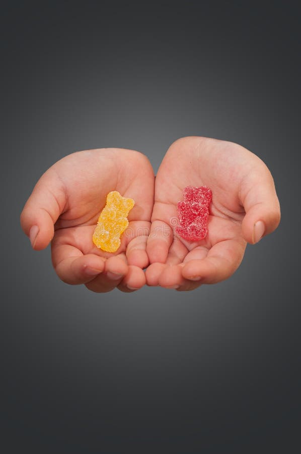 Hands with Gummy Bears editorial photo. Image of candy - 47544161