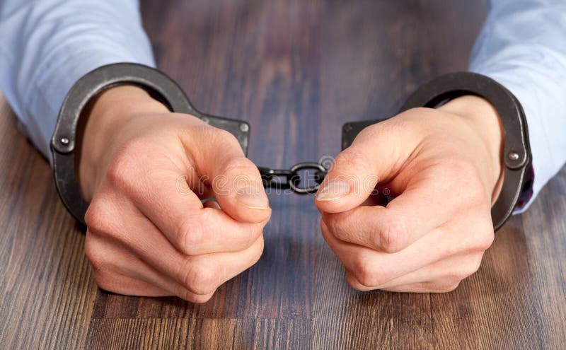 Hands in handcuffs stock image. Image of closeup, detainee - 29235943