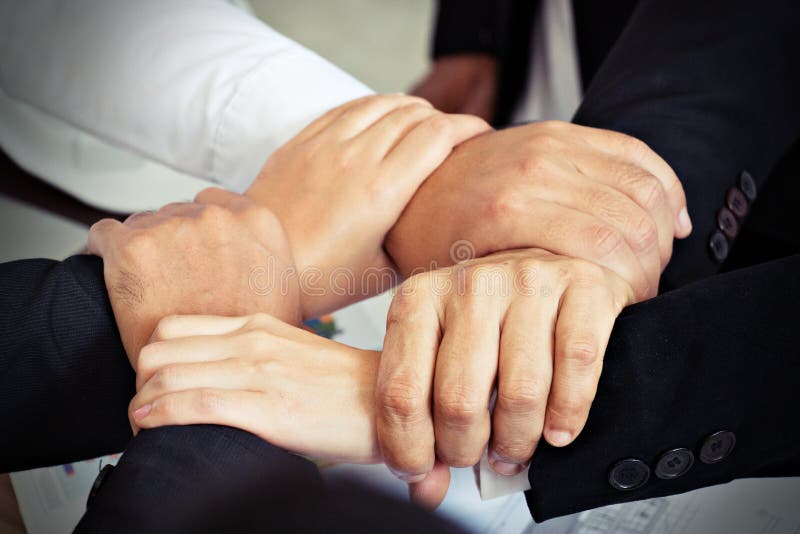 Hands on Hands Teamwork and Partnership Sign Stock Photo - Image of ...