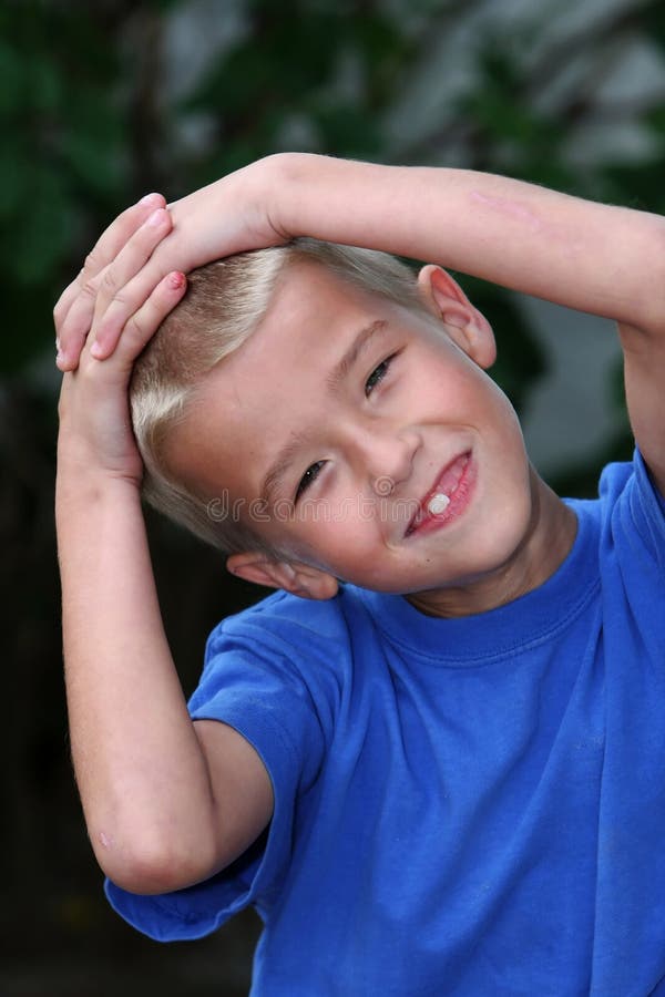 Hands on Head Boy stock image. Image of grin, angle, hands - 9609879