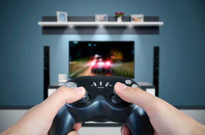 Hands Hold The Game Controller. Man Playing A Car Racing On TV Stock ...