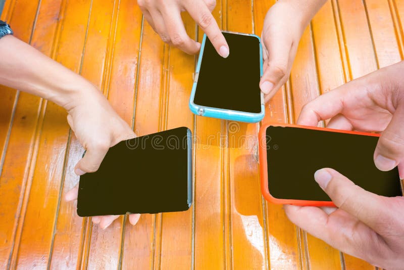 Hands Hold Mobile Phones on a Table Stock Photo - Image of females ...