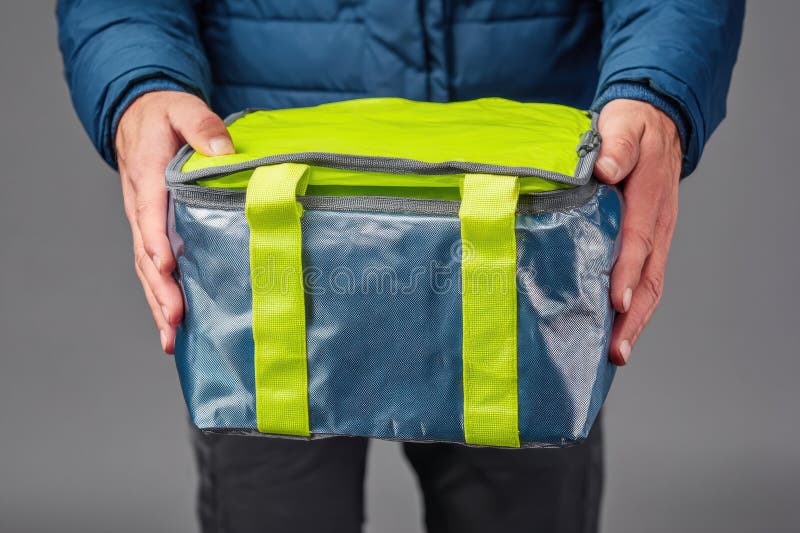 Hands Hold a Reusable Insulated Delivery Bag Designed for Safe ...