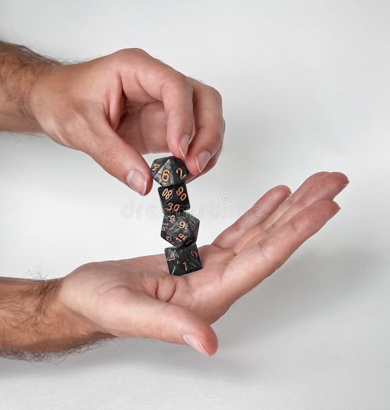 Hands Holding and Balancing Polyhedral Dice Set for Tabletop Gaming ...