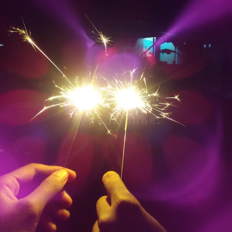 Hands Holding Beautiful Fireworks Flame at Night Stock Photo - Image of ...