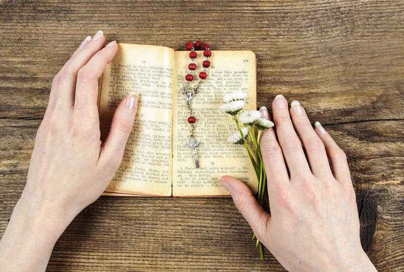 Hands Holding the Bible and Praying with a Rosary Stock Photo - Image ...